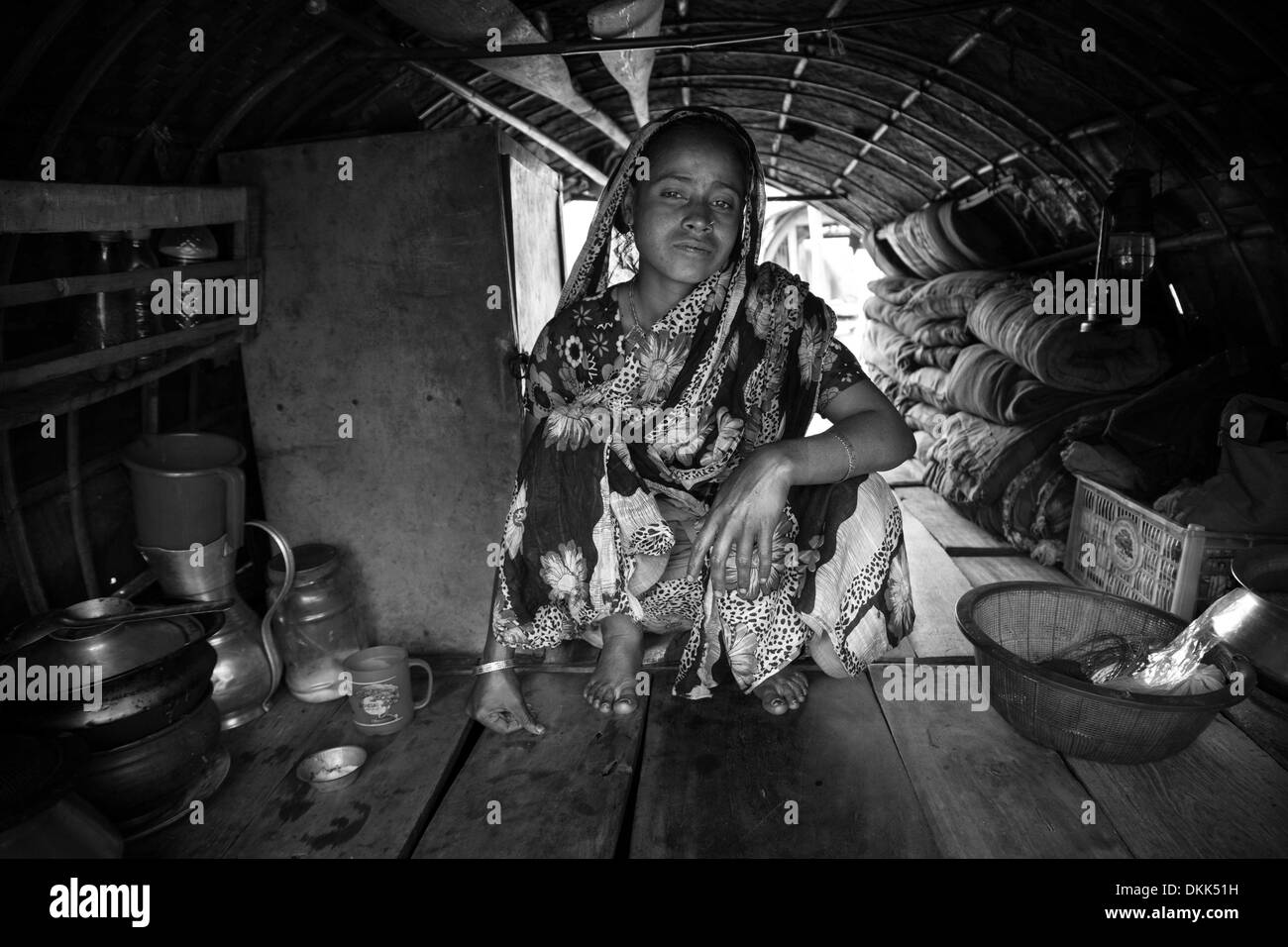 Sonargaon, Bangladesh. 21st Feb, 2013. A river gypsy (Bede) woman looks ...