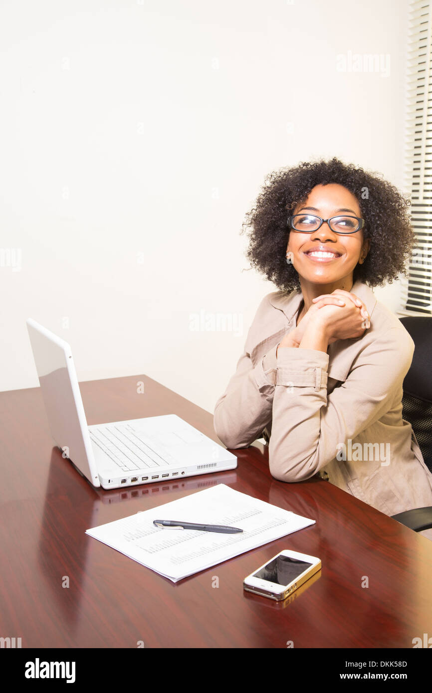 African American woman smiling at work Stock Photo - Alamy