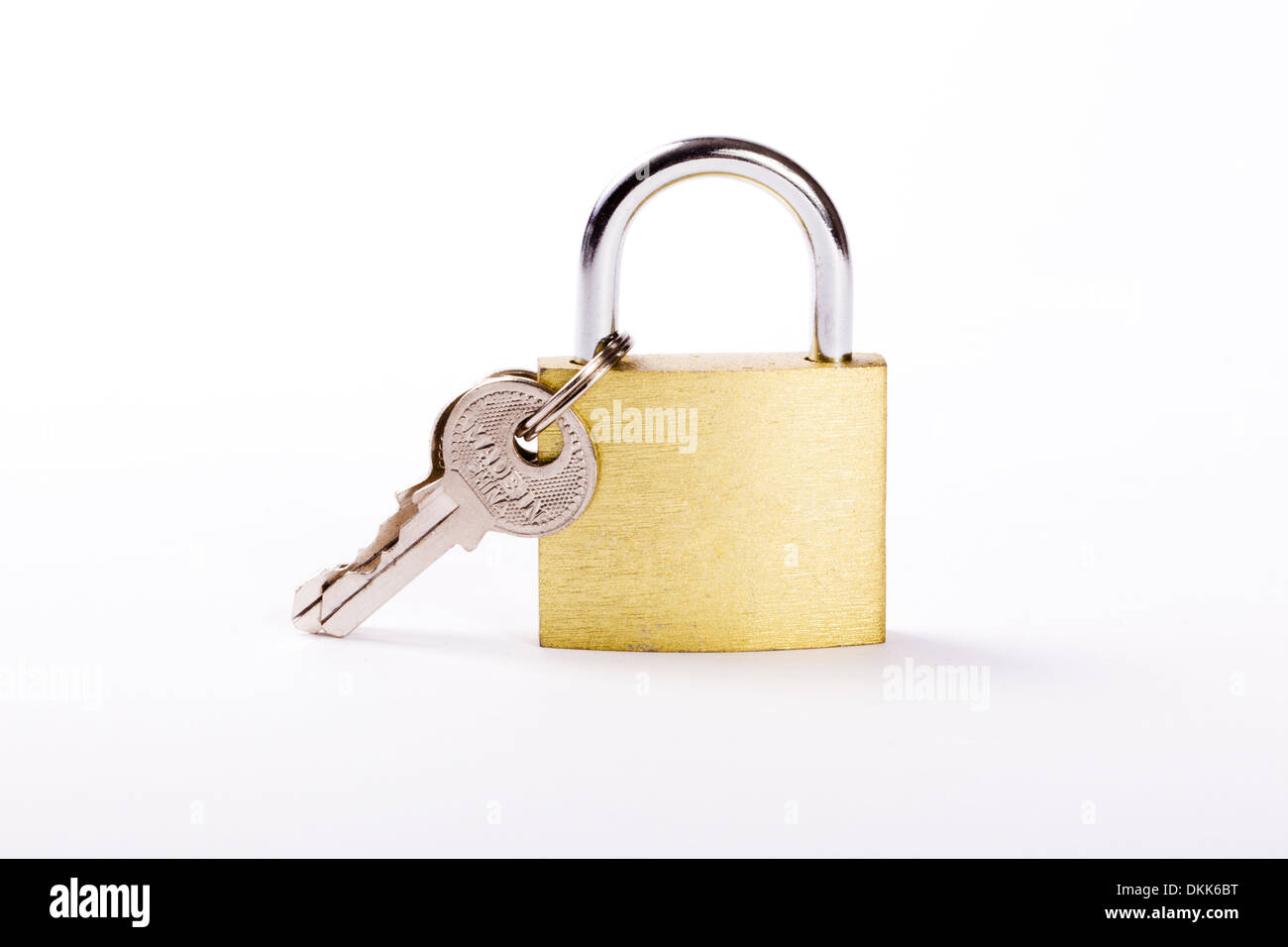 Brass padlock with key Stock Photo - Alamy