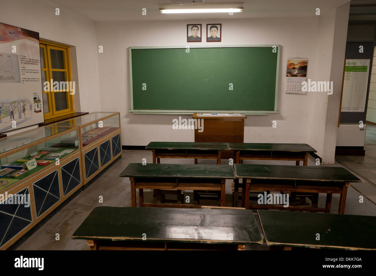 Mock-up of North Korean school classroom displaying portraits of Kim Il ...