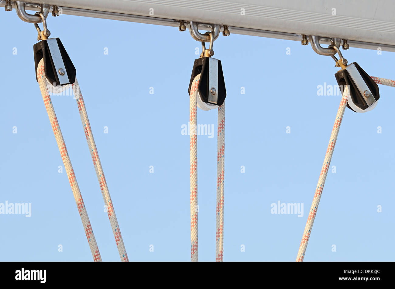 Detail of three nautical pulleys with rope Stock Photo - Alamy