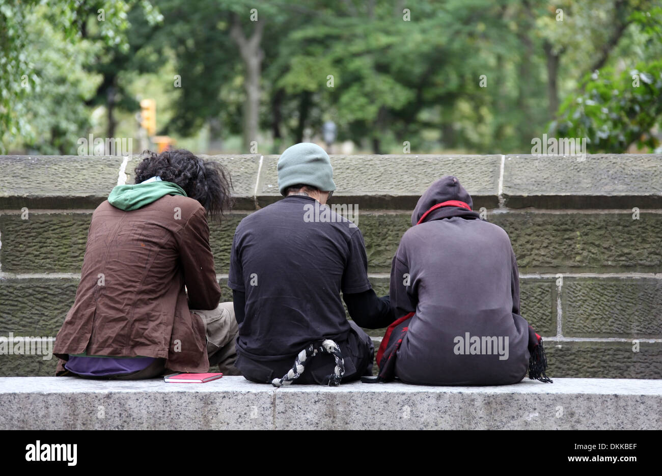 Three people talking backs hi-res stock photography and images - Alamy