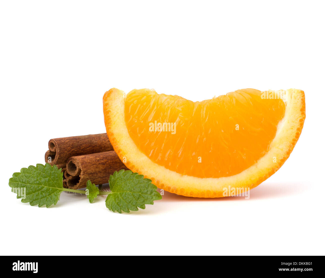 Orange fruit segment, cinnamon sticks and mint isolated on white ...