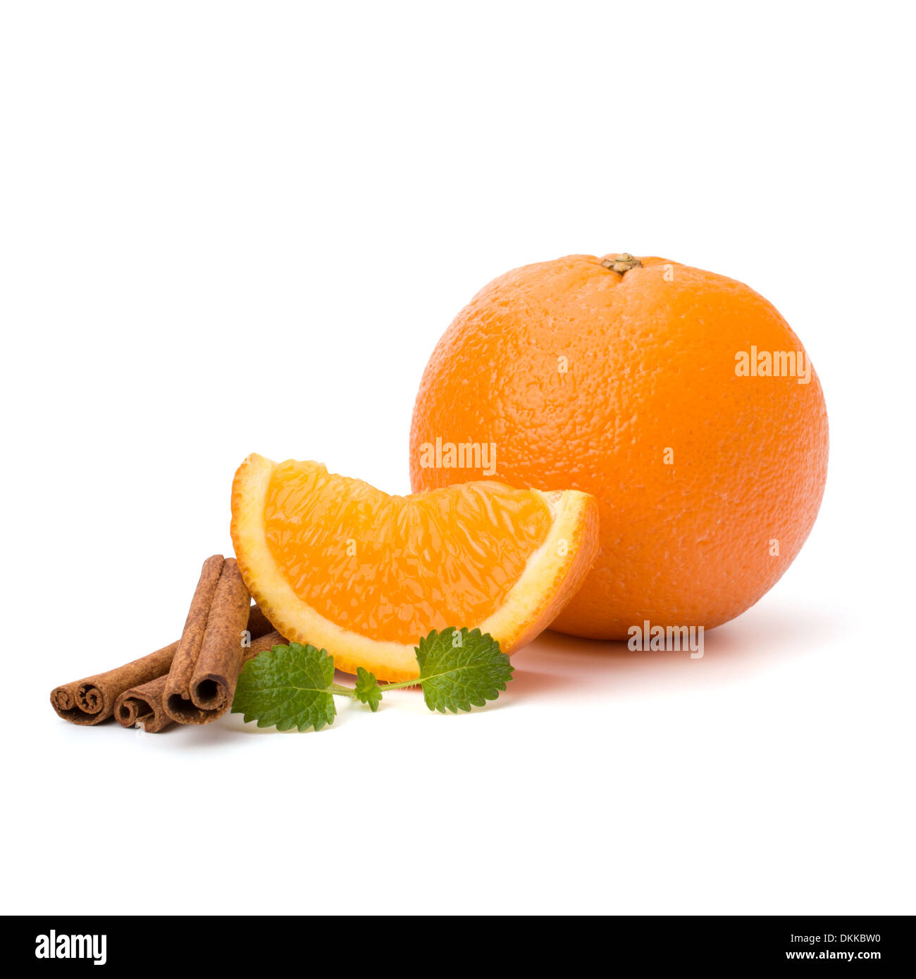 Orange fruit segment, cinnamon sticks and mint isolated on white ...