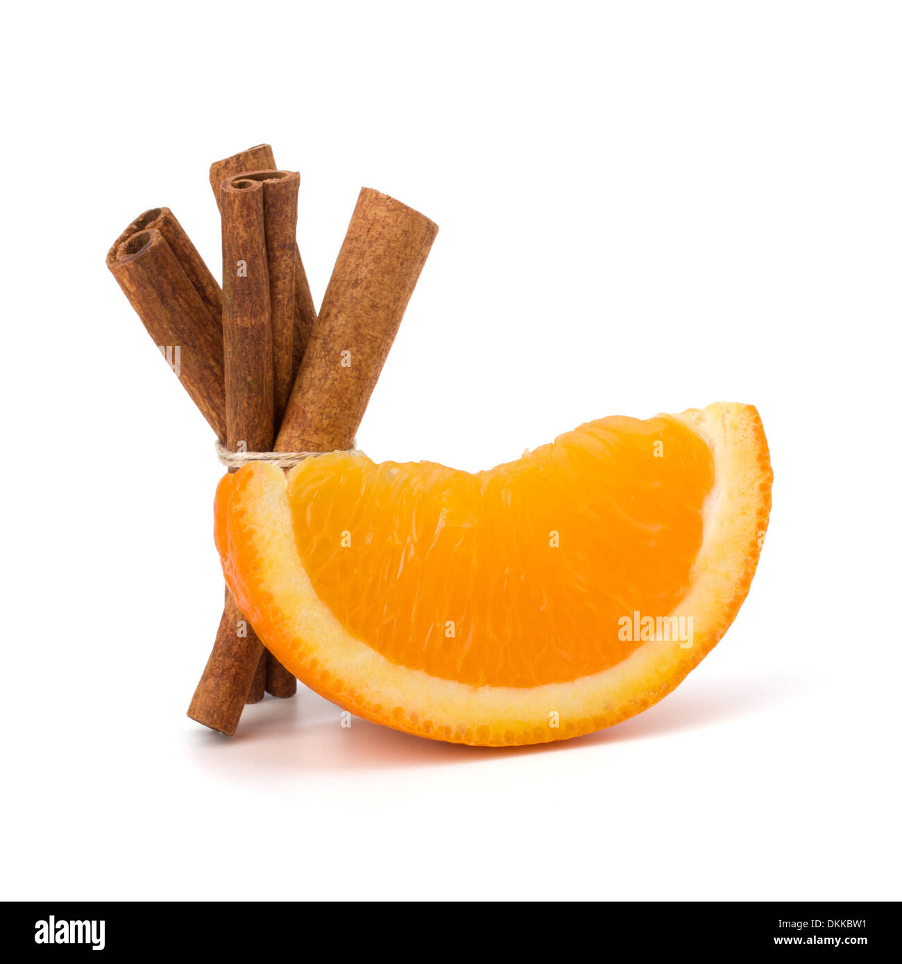 Orange fruit segment and cinnamon sticks isolated on white background ...