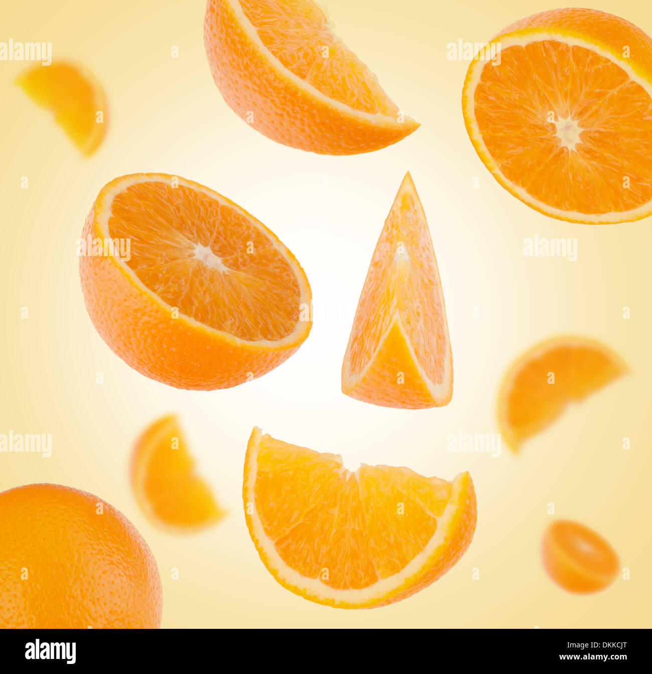 flying sliced orange fruit segments background Stock Photo - Alamy