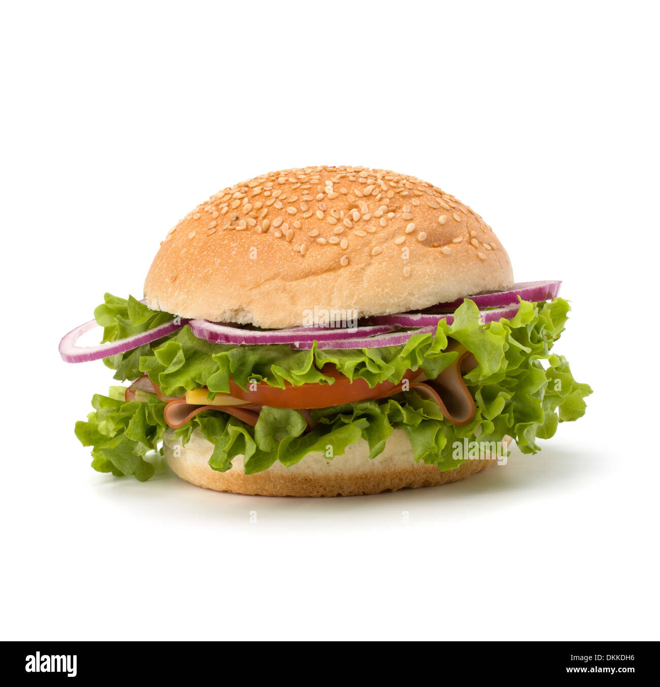 Big appetizing fast food sandwich with lettuce, tomato, smoked ham and ...