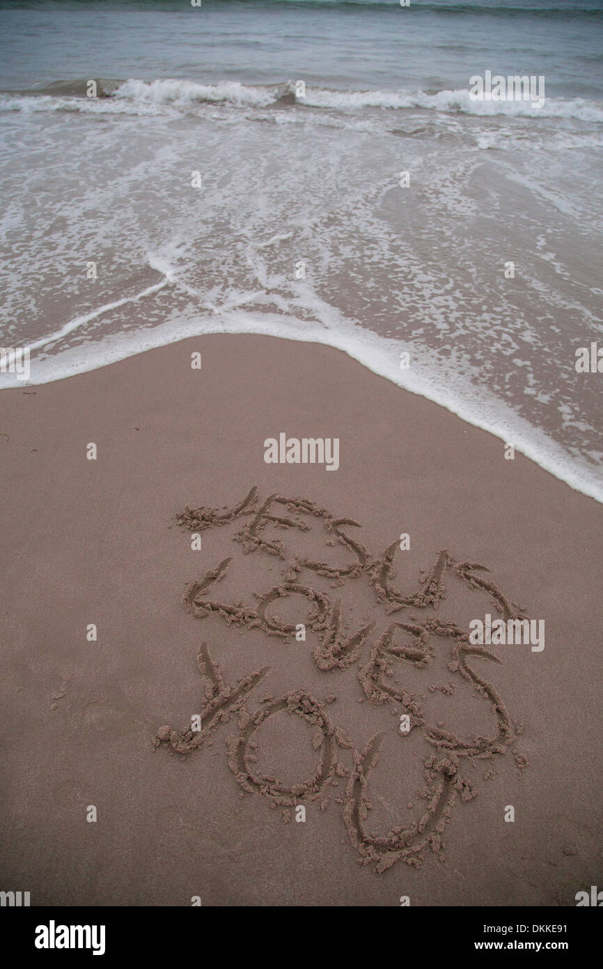 "Jesus Loves You" written in the sand Stock Photo - Alamy