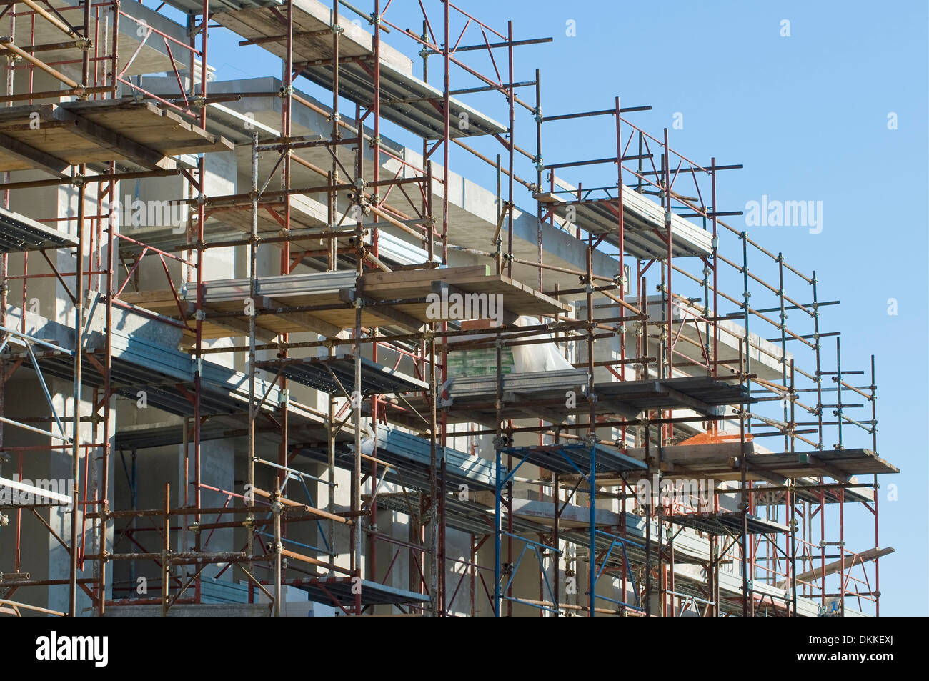 Building under construction with scaffolding Stock Photo - Alamy