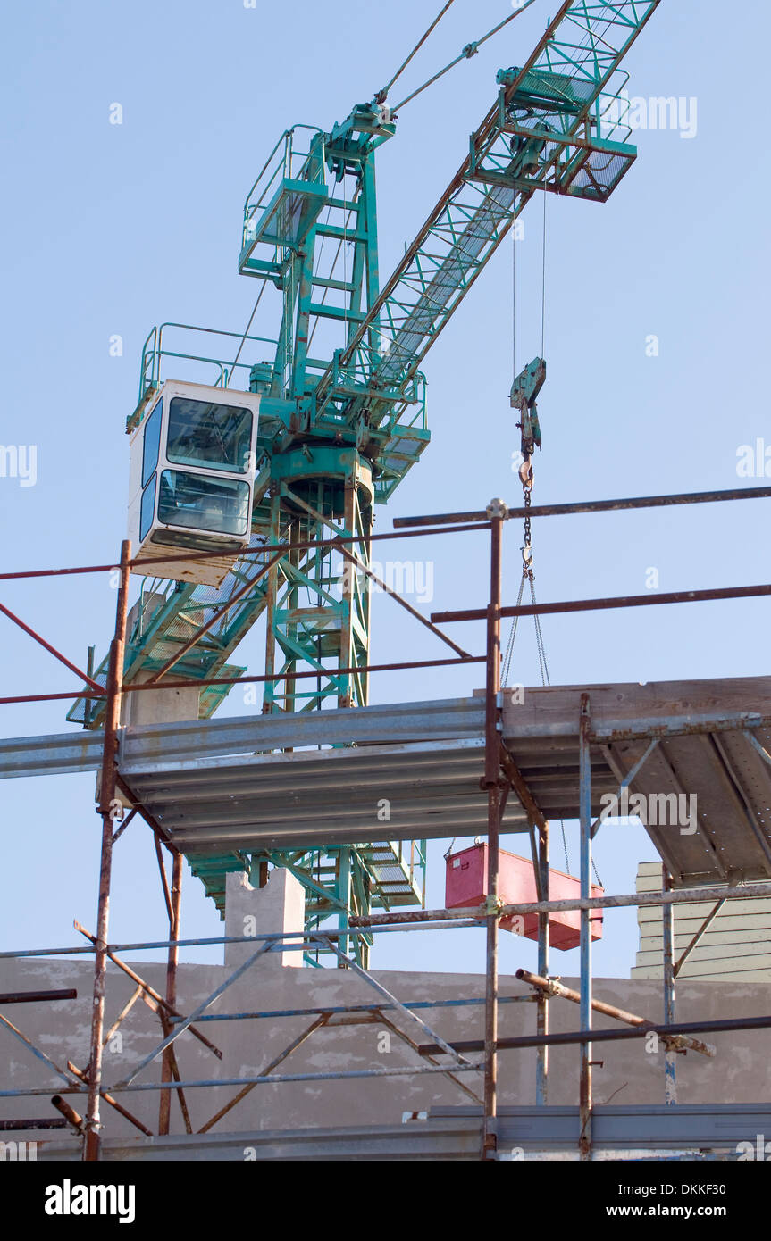 Crane and scaffolding in a contruction site Stock Photo - Alamy