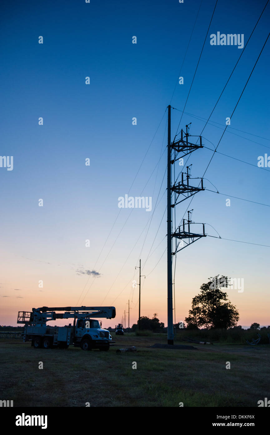 Western Farmer's Electric linemen work to repair a high voltage ...