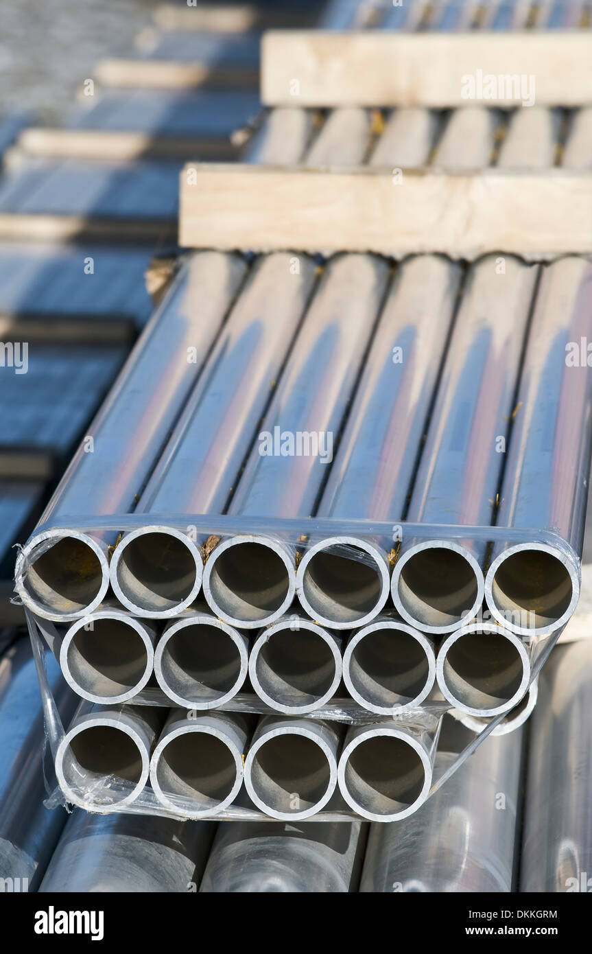 Stack of pipes used in construction industry Stock Photo - Alamy