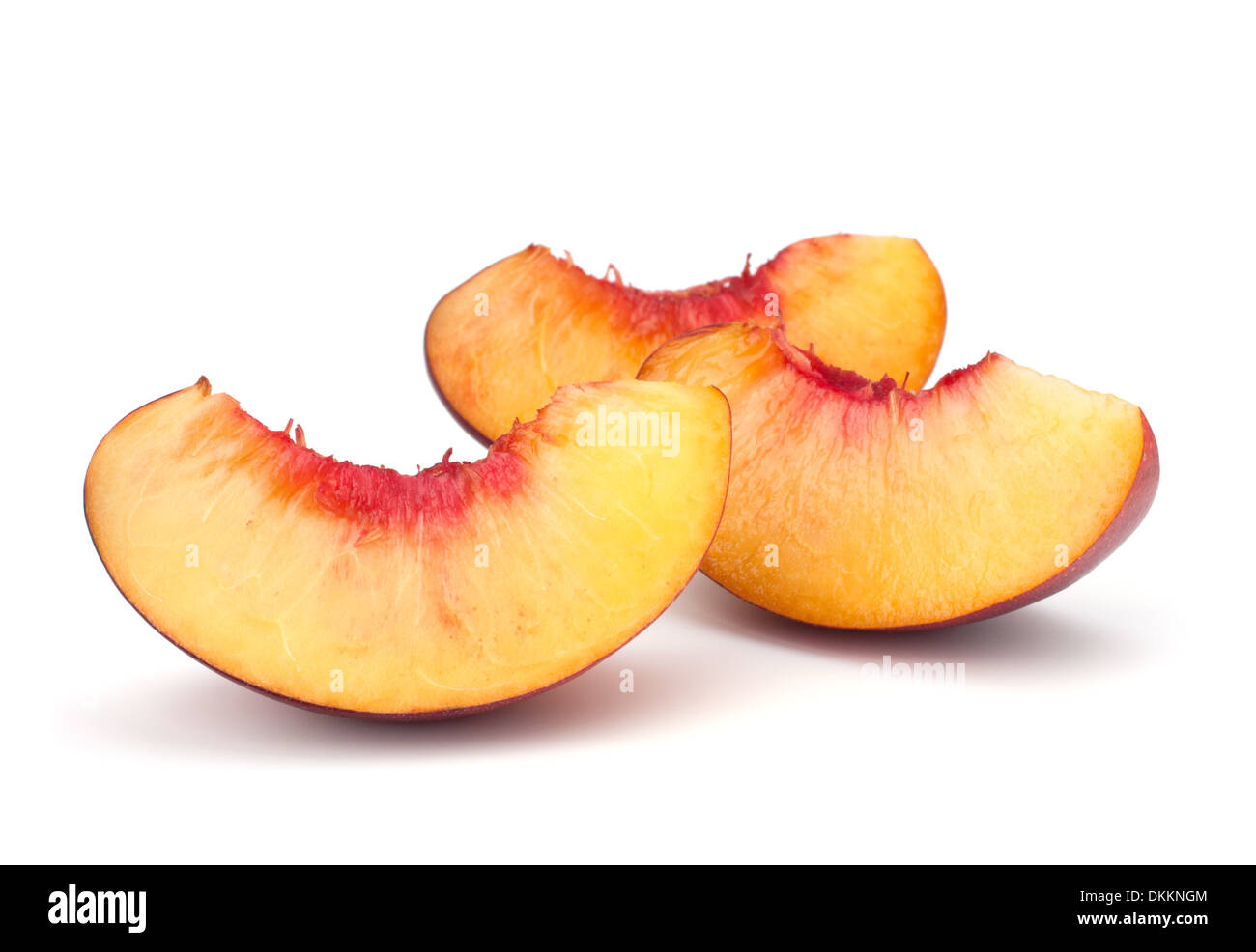 Nectarine fruit segments isolated on white background Stock Photo - Alamy