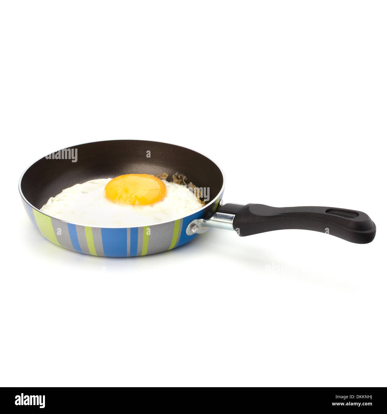 Fried egg on pan over white background Stock Photo - Alamy