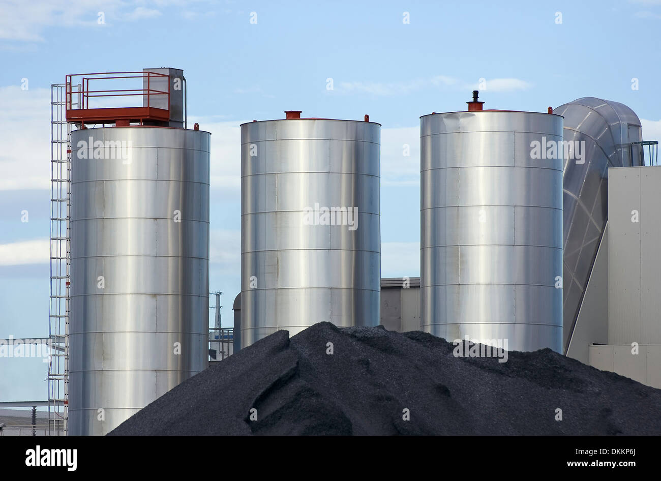 Metallic silos with stack of ground of an industrial plant Stock Photo ...