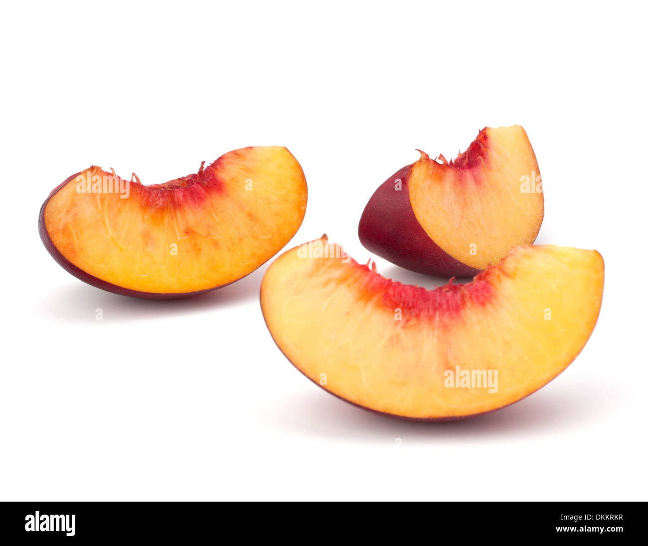 Nectarine fruit segments isolated on white background Stock Photo - Alamy