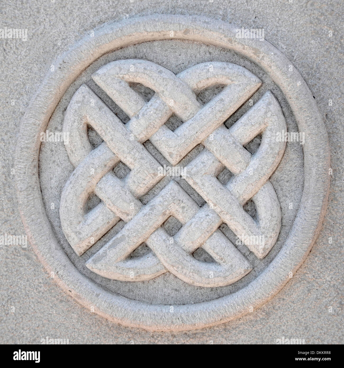 Sculptured circular symbol decoration on a stone Stock Photo - Alamy