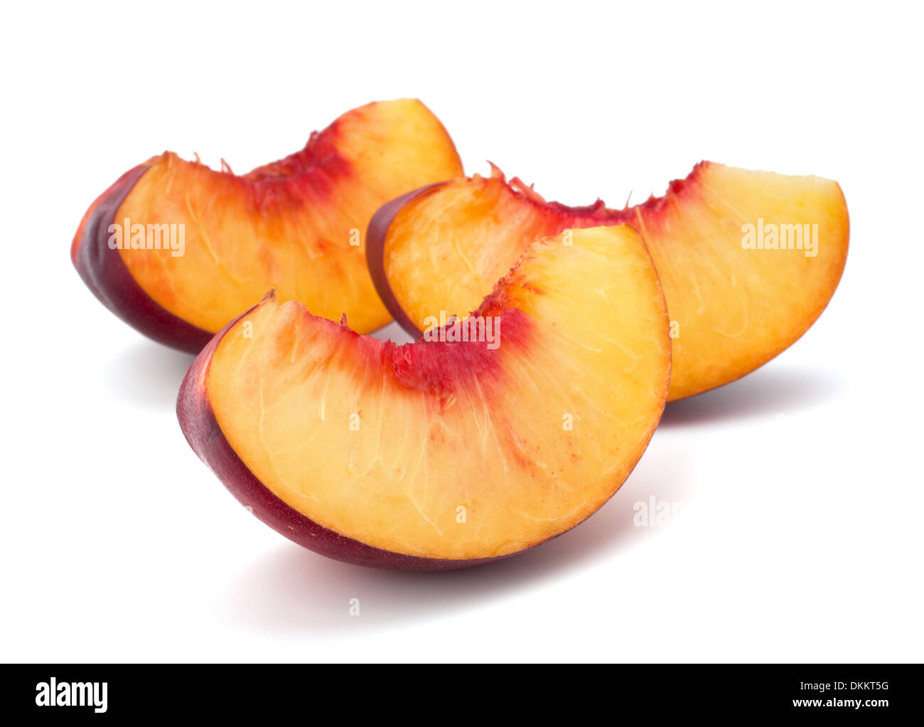Nectarine fruit segments isolated on white background Stock Photo - Alamy