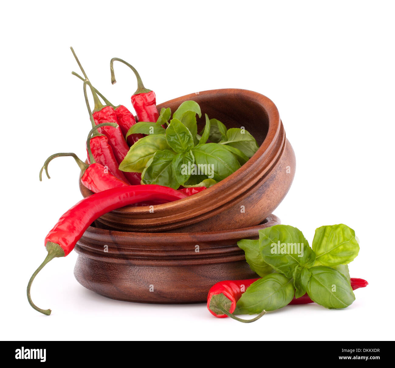 Hot red chili or chilli pepper in wooden bowls stack isolated on white ...