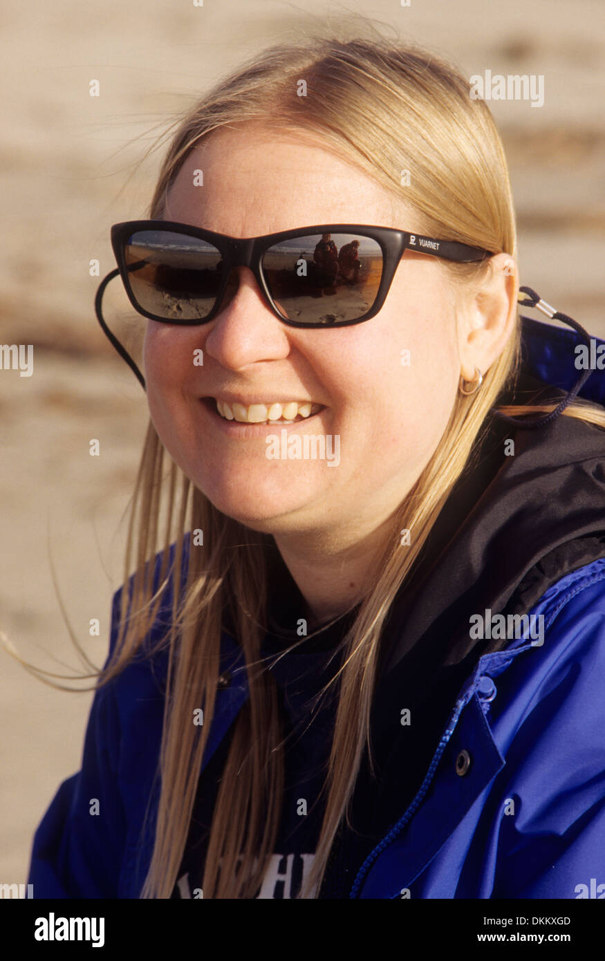 Woman smiling on beach, Bayocean Peninsula, Oregon Stock Photo - Alamy