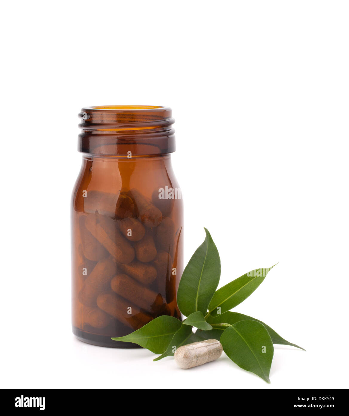 Herbal drug capsules in brown glass bottle isolated on white background ...
