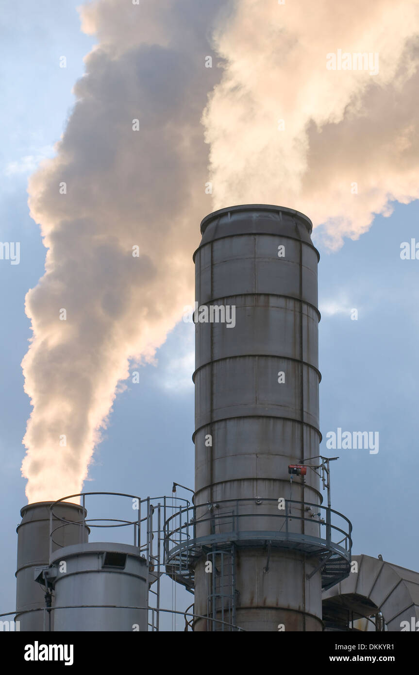 Detail of smokestacks with white smoke Stock Photo - Alamy
