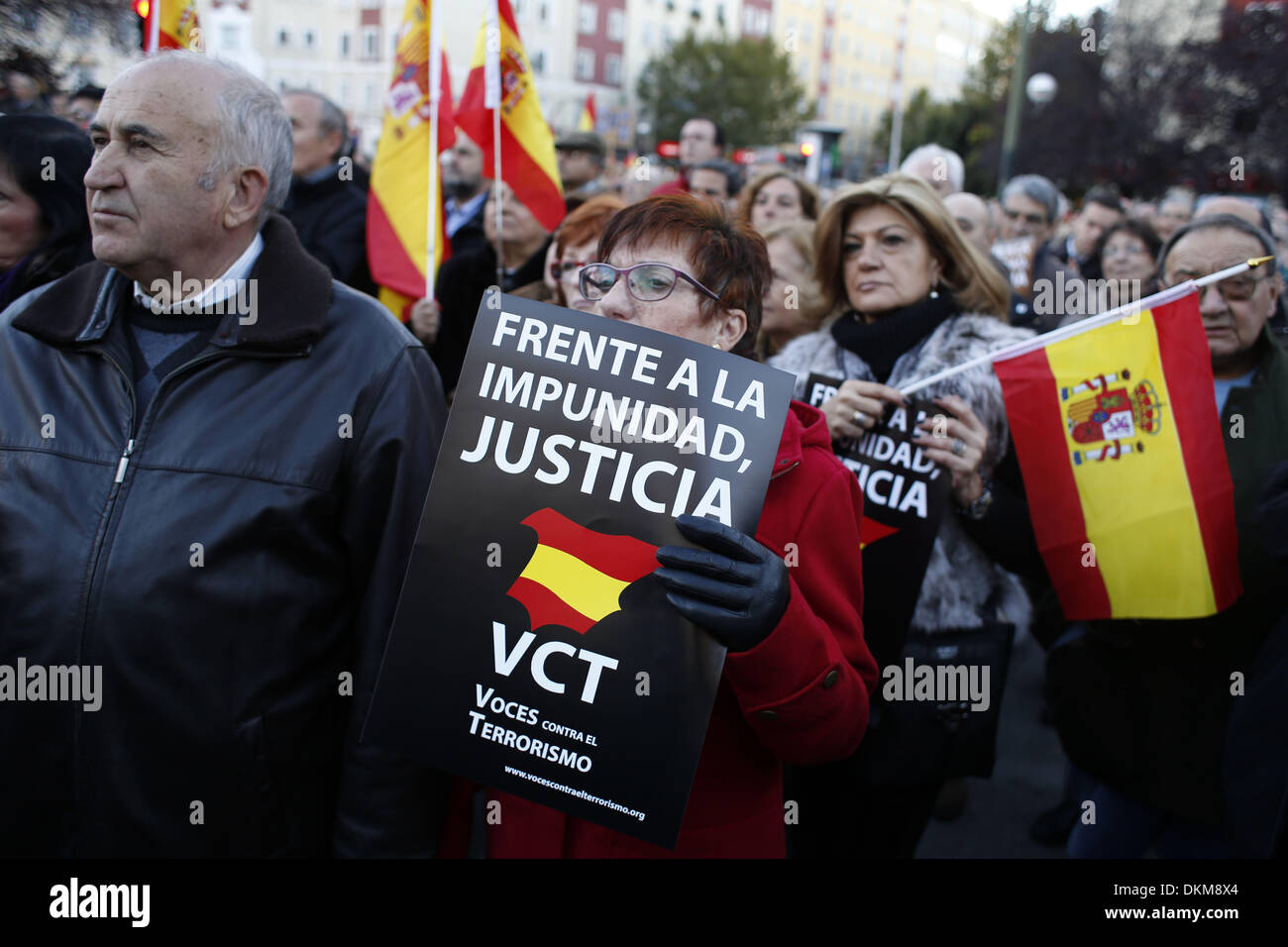 Madrid, Spain. 6th Dec, 2013. Protestors hold spanish flags and ...
