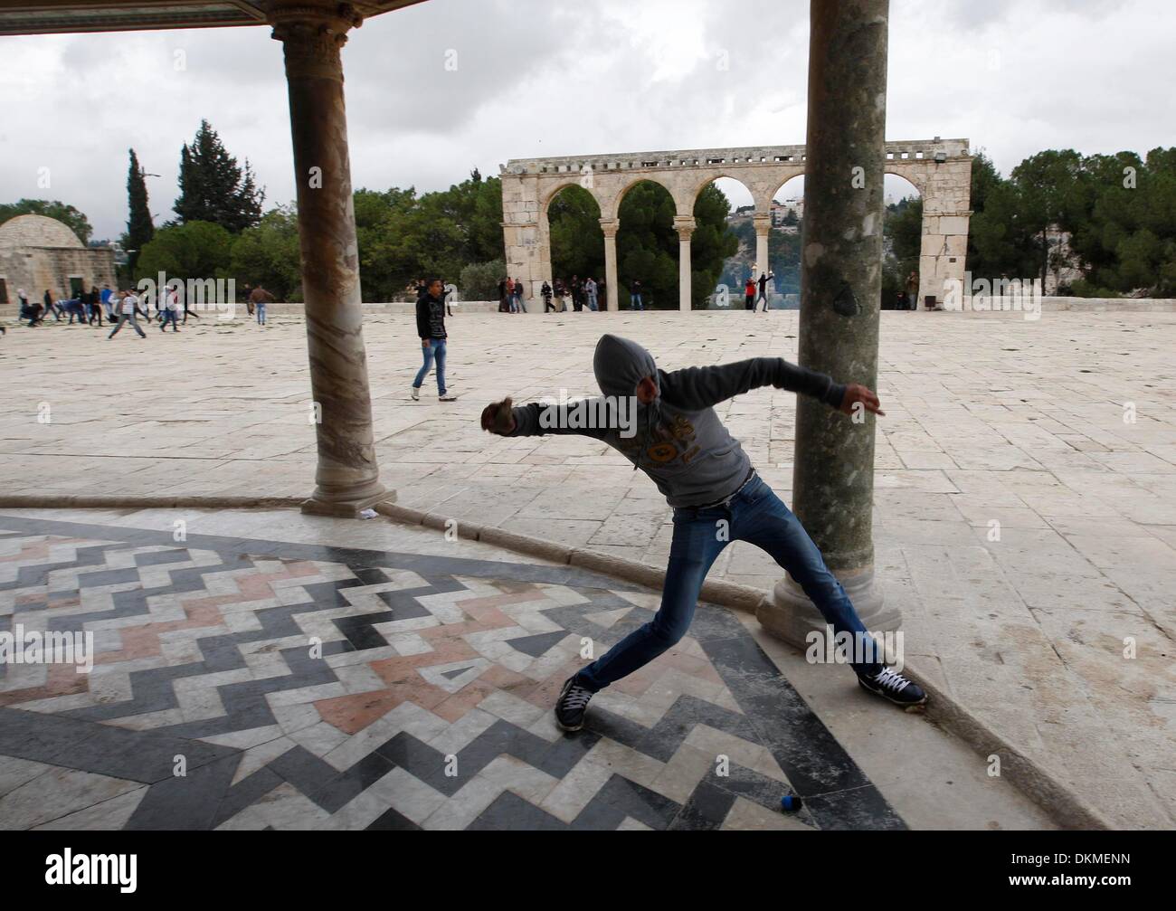 Jerusalem, Israel. 6th Dec, 2013. A Palestinian protester hurls a stone ...