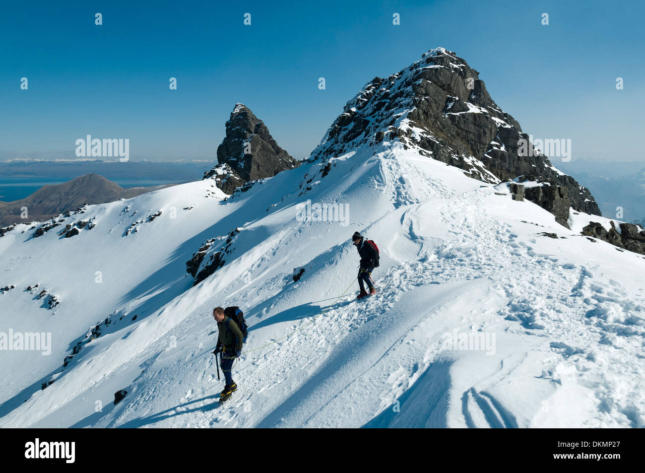 Am Basteir and Sgurr a' Fionn Choire with two climbers on the main ...