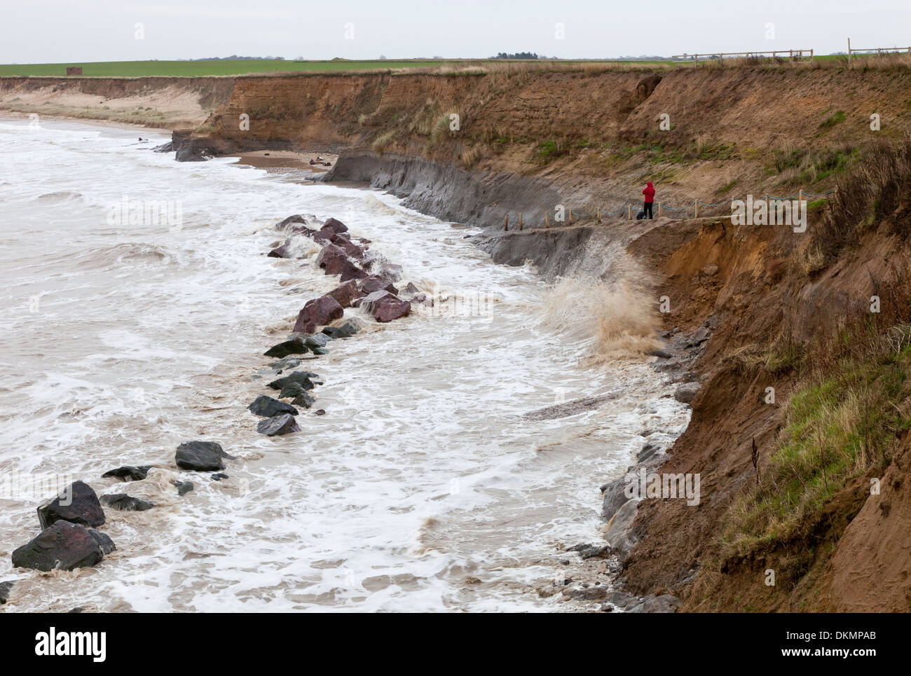 High Tide at Happisburgh in Norfolk England, with a photographer taking ...