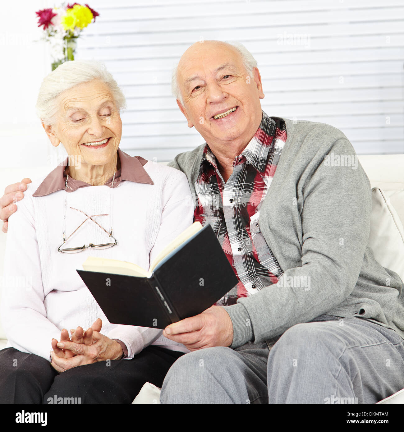 Carefree elderly couple reading hi-res stock photography and images - Alamy