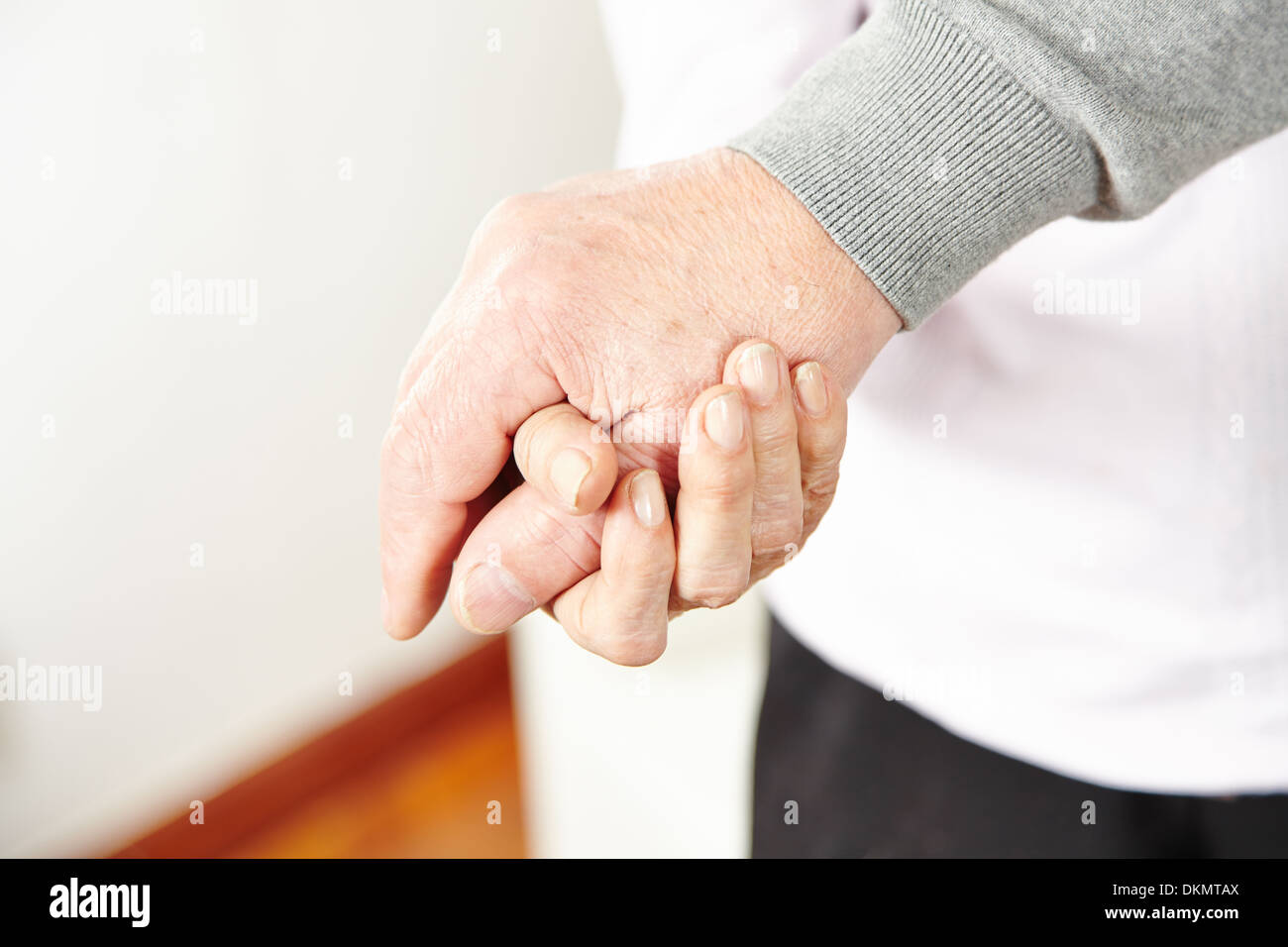 Senior citizens in love holding their hands Stock Photo - Alamy