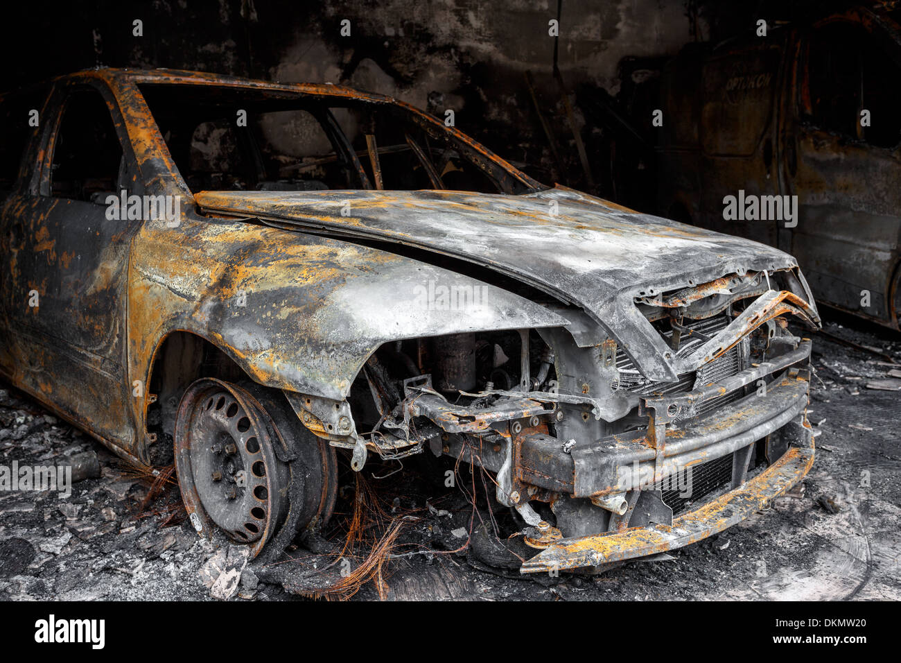 Close up photo of a burned out car in garage after fire for grunge use ...