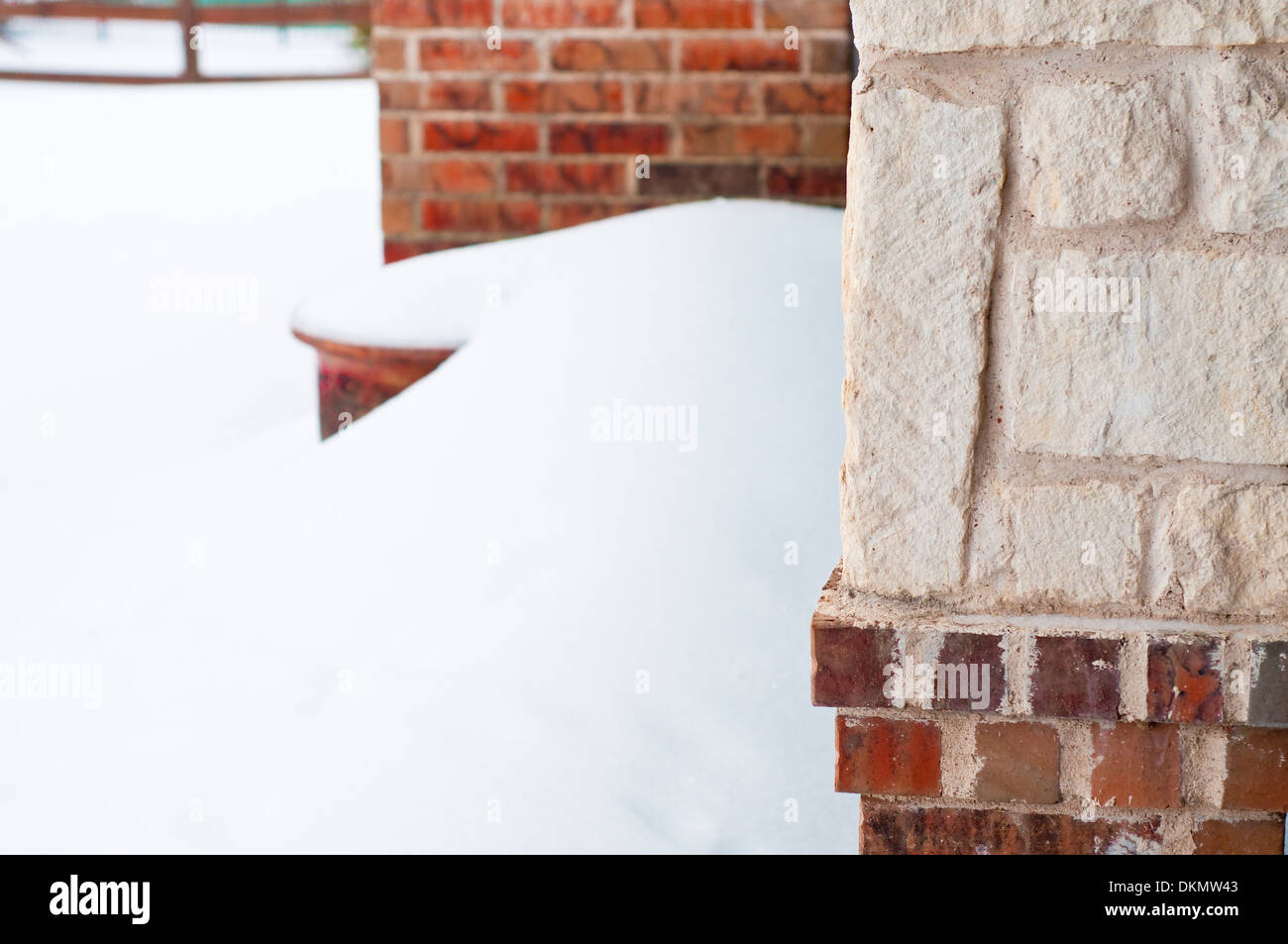 Snow covering the front of residential brick home Stock Photo - Alamy