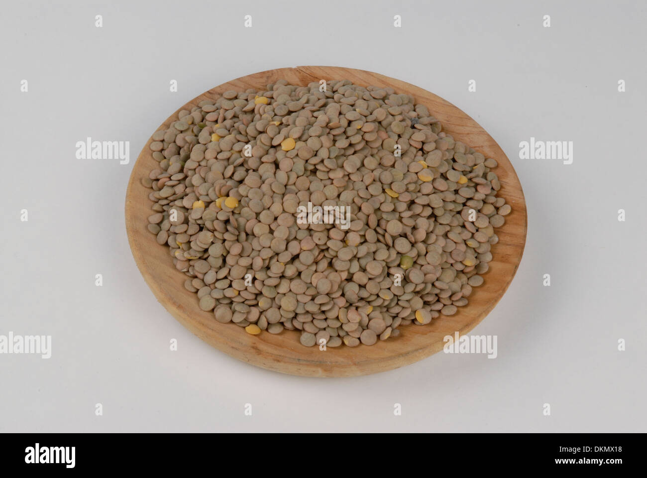 lentils in a wooden plate Stock Photo - Alamy