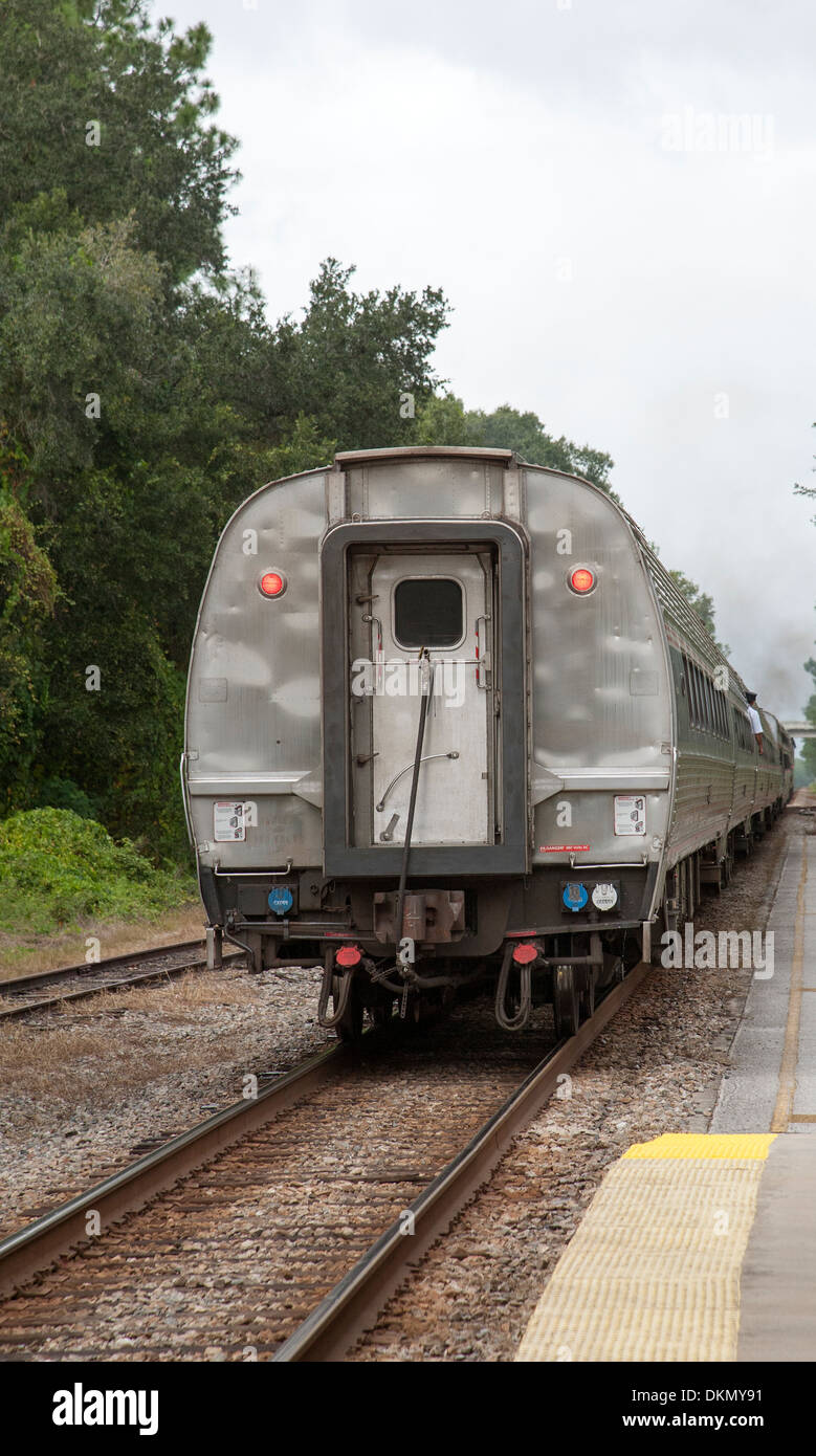 The end. Last view of passenger train going down track Stock Photo - Alamy