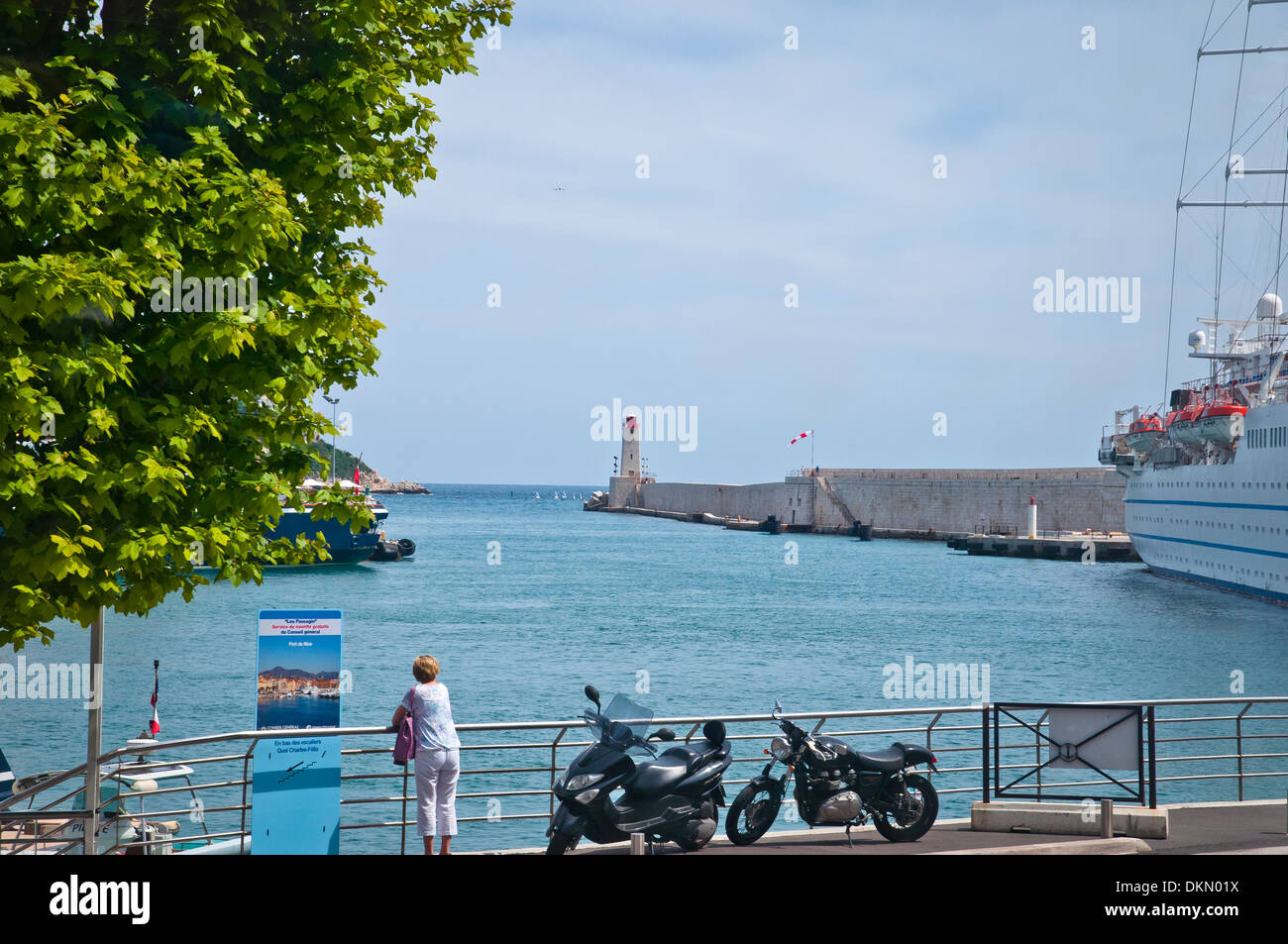 A tourists admire views of waterfront, Nice, French Riviera, France ...