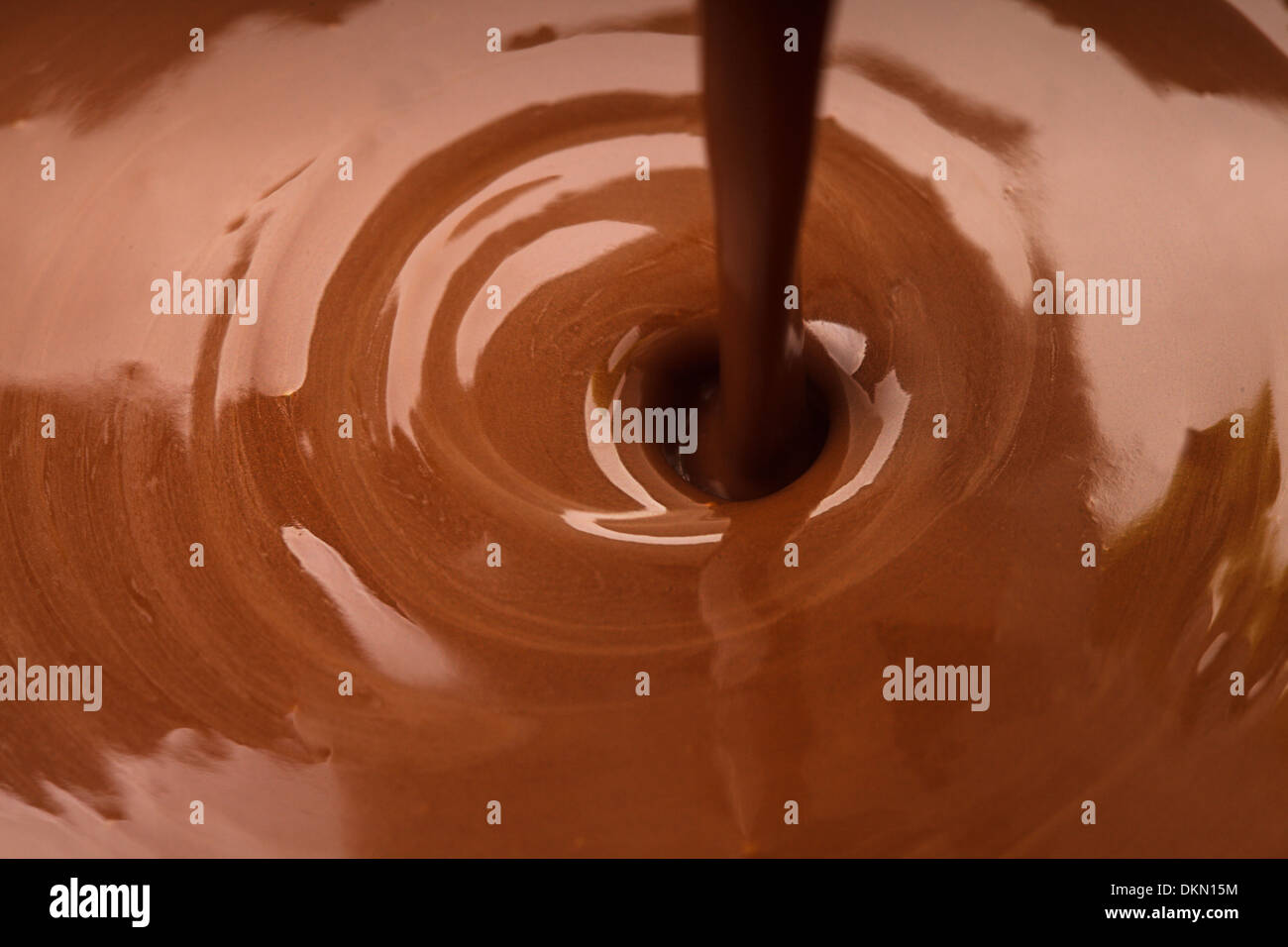 Chocolate flow close up as a background Stock Photo - Alamy