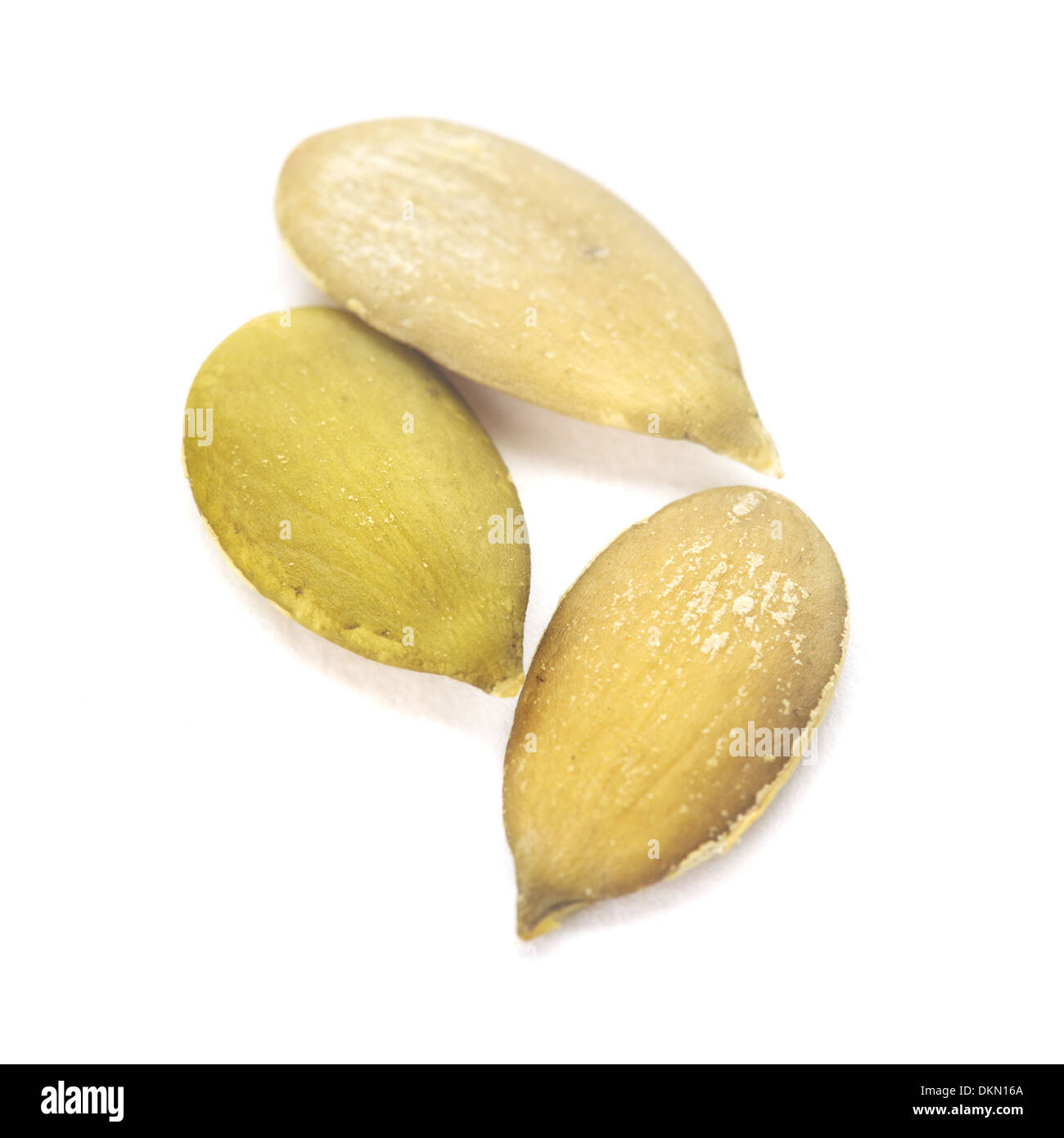 Peeled pumpkin seeds isolated on white Stock Photo - Alamy