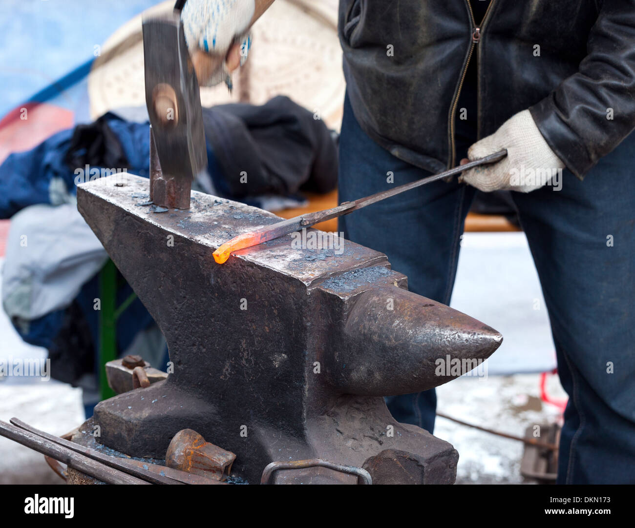 Blacksmith forges iron in the forge Stock Photo - Alamy