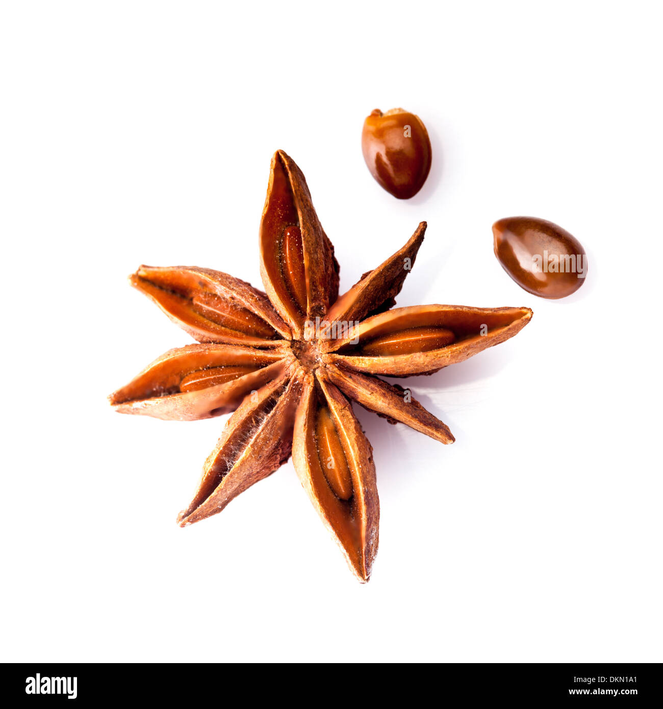 Anise stars heap isolated on white background Stock Photo - Alamy