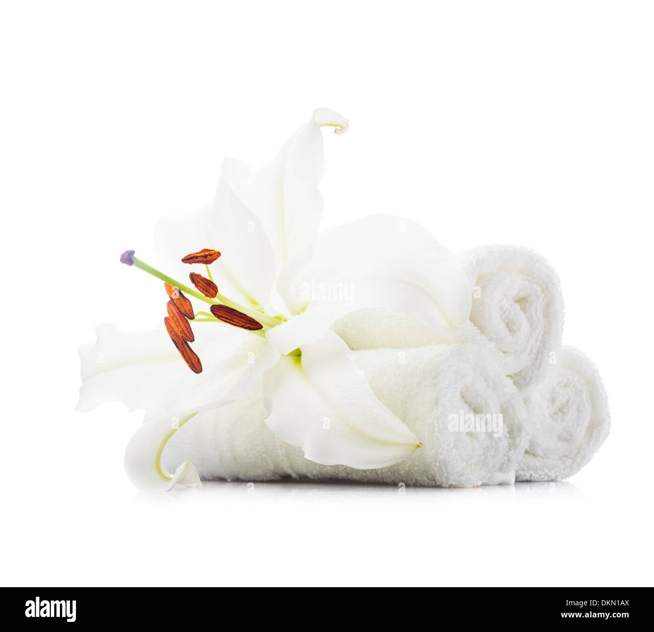 White spa towels pile with lily flower isolated on white Stock Photo ...