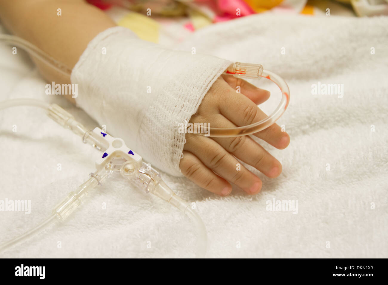 Children's patient in the hospital with saline intravenous (iv) drip ...