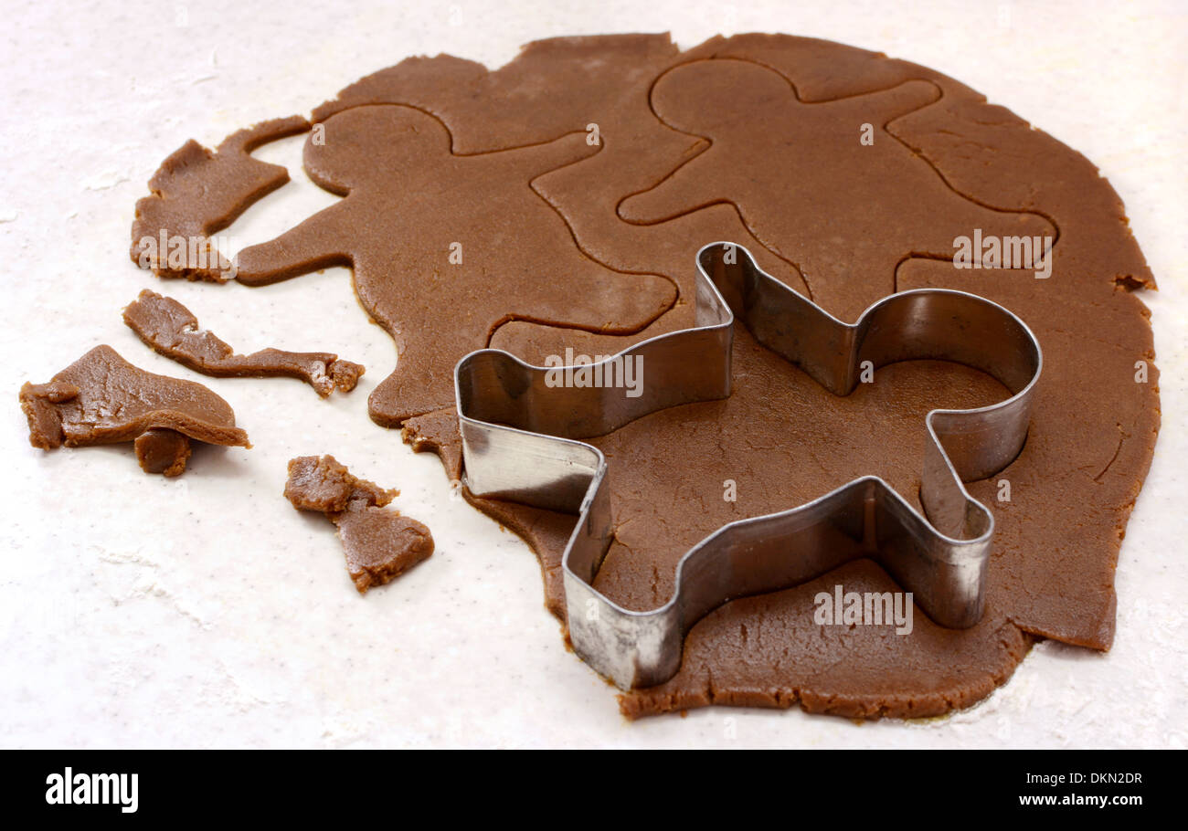 Gingerbread man shapes and cutter in cookie dough Stock Photo - Alamy