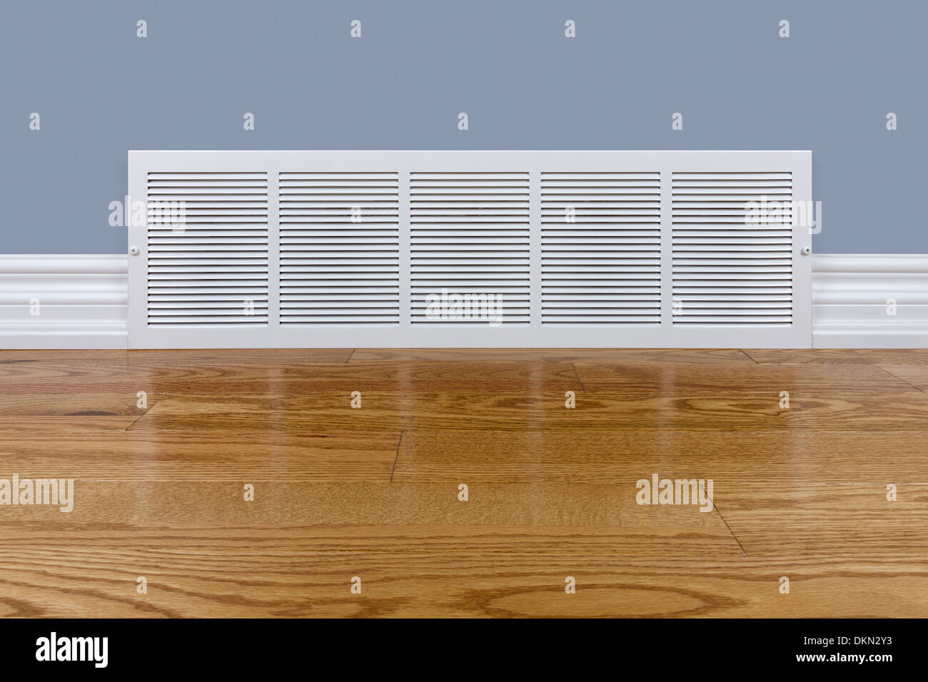 Wall cold air return grille sitting on hardwood floor Stock Photo - Alamy