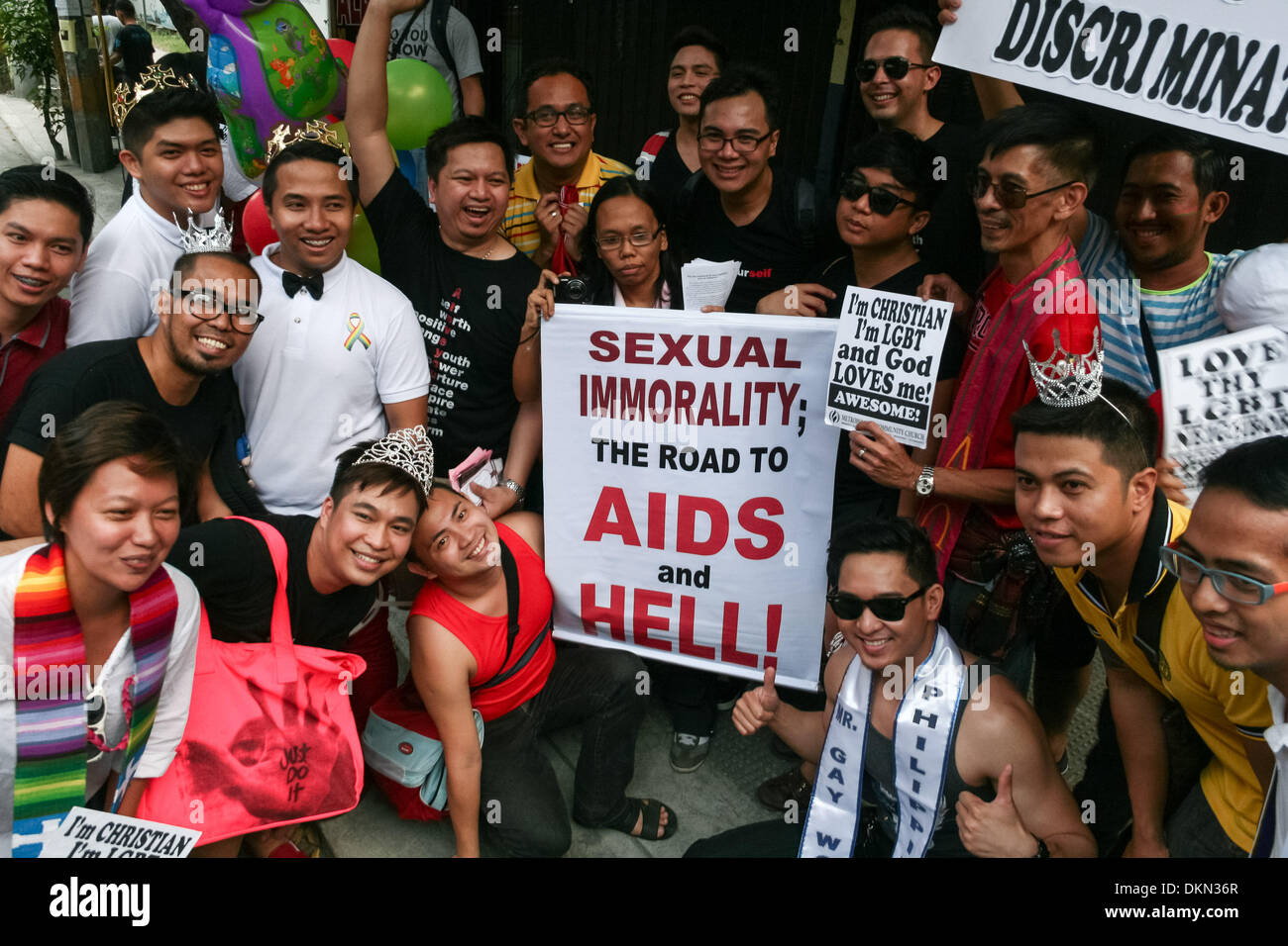 Manila, Philippines. 7th Dec, 2013. A female anti-gay advocate holds up ...