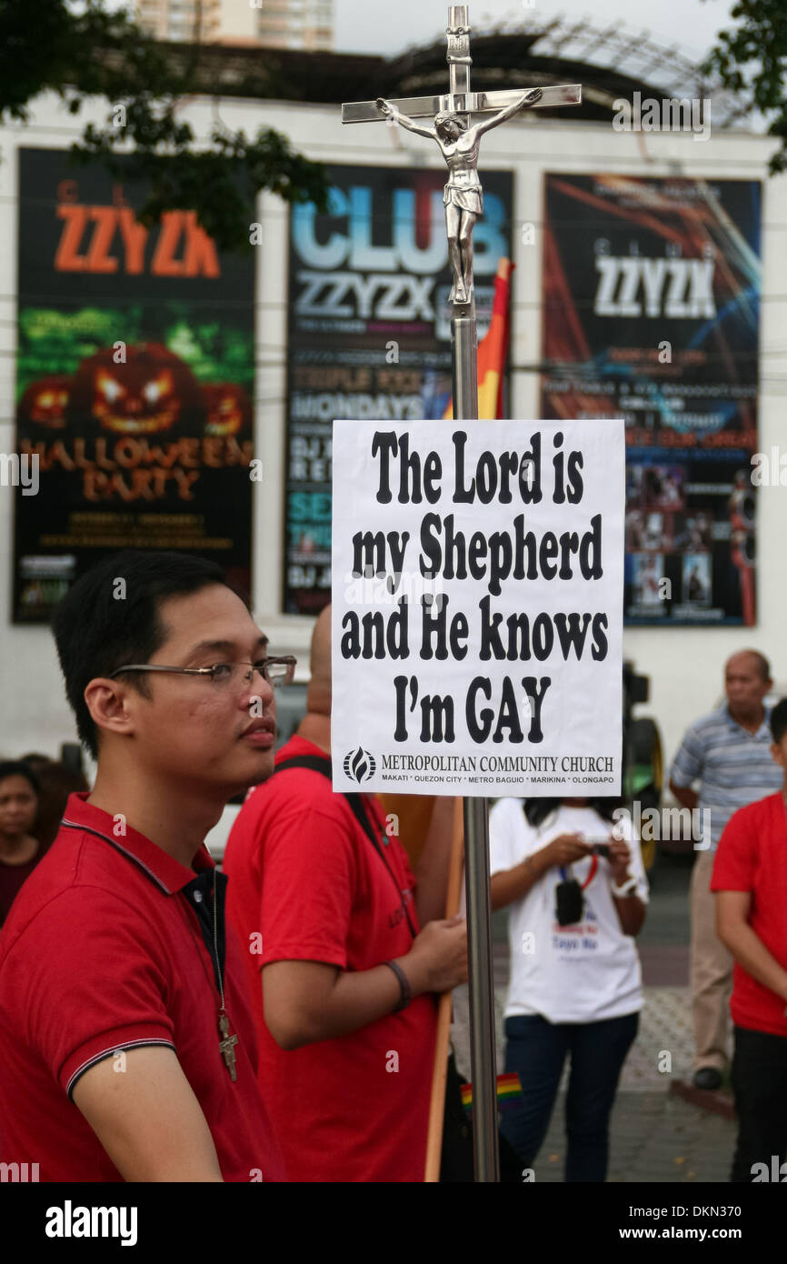 Manila, Philippines. 7th Dec, 2013. Gay Pride Parade attendee display a ...