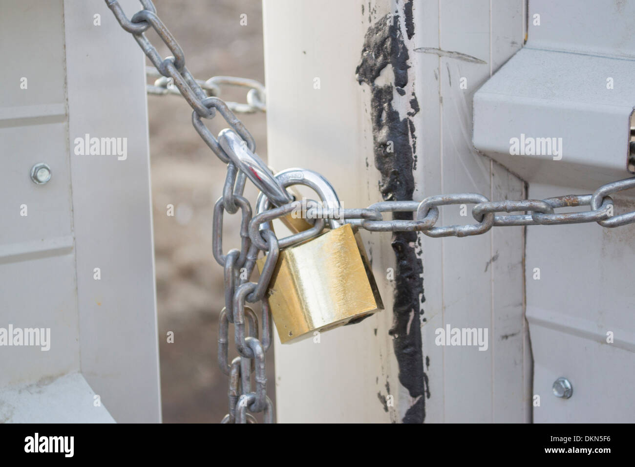 Close-up view of padlock and chain link at construction site Stock ...