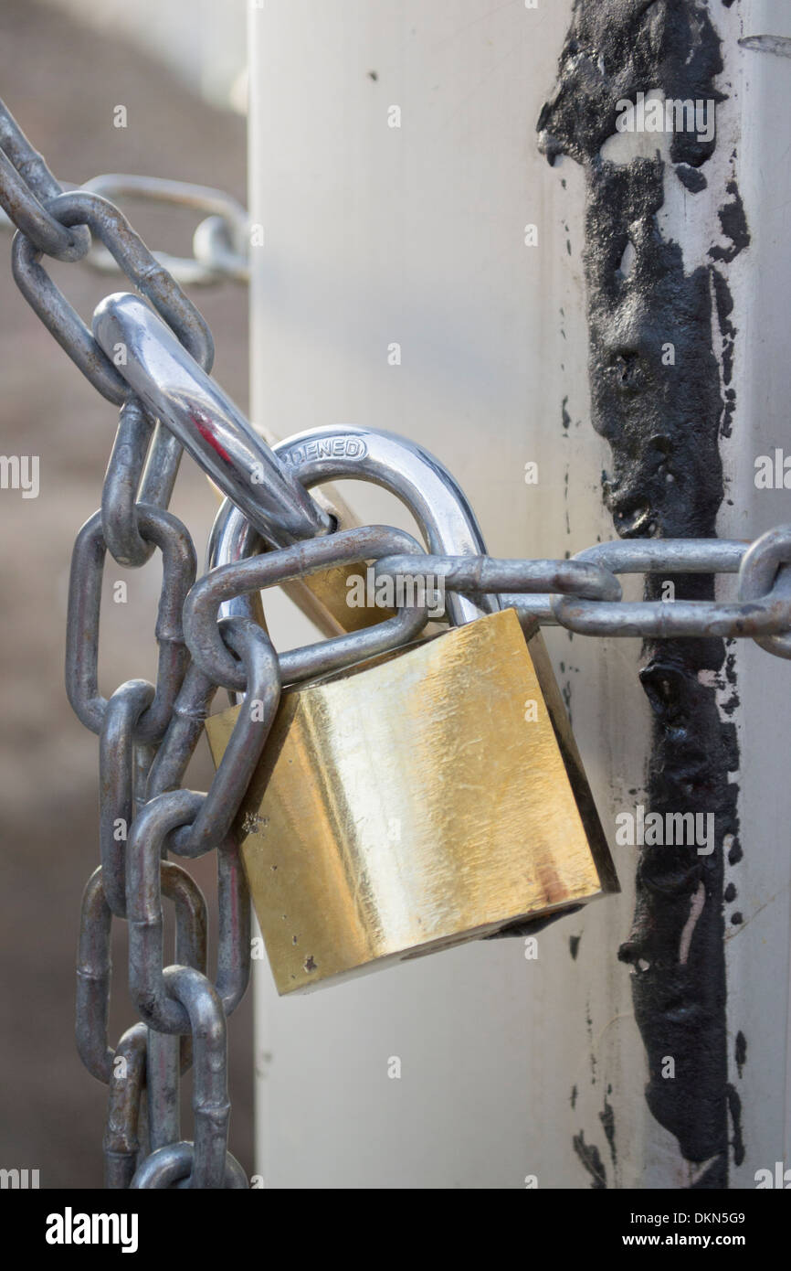 Close-up view of padlock and chain link at construction site Stock ...