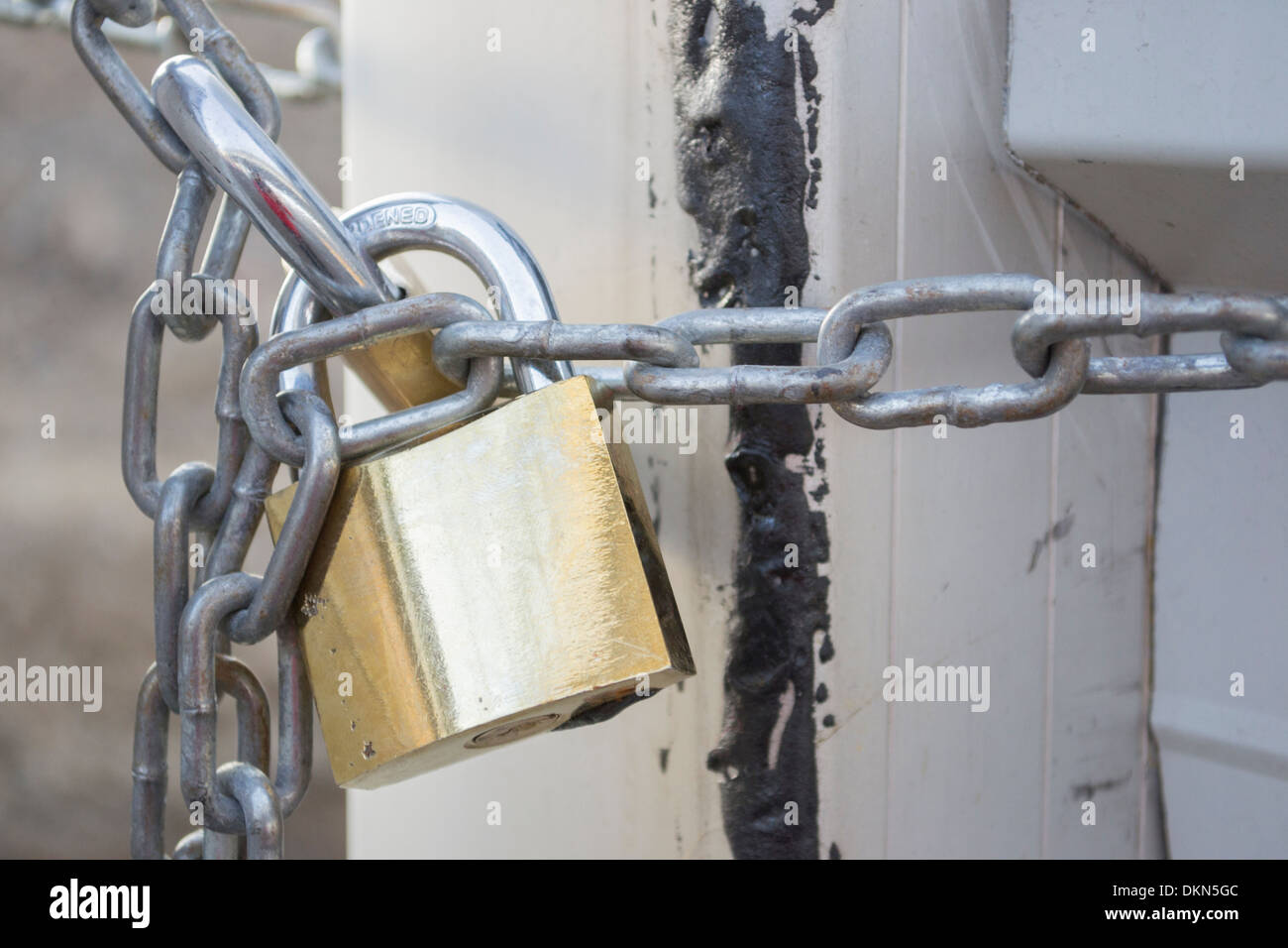 Close-up view of padlock and chain link at construction site Stock ...